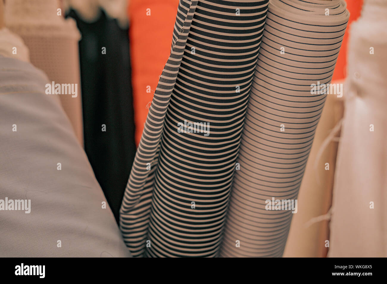 Rolls of natural high fashion fabrics and textiles. Sewing industry ...