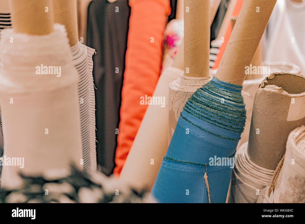 Rolls of natural high fashion fabrics and textiles. Sewing industry ...