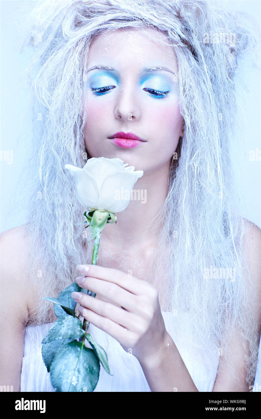 close-up portrait of beautiful blonde frozen fairy nymph girl with ...