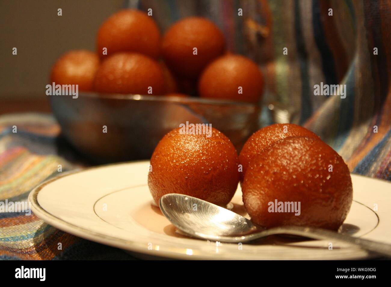 Gulab jamun with spoon hi-res stock photography and images - Alamy