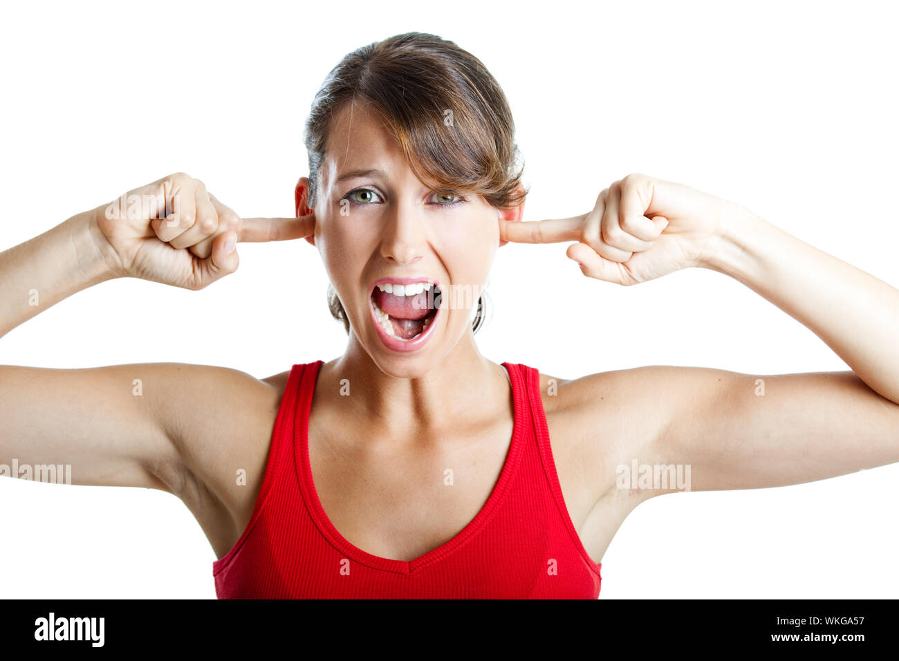 Portrait of disturbed young woman screaming while putting her finger on ...