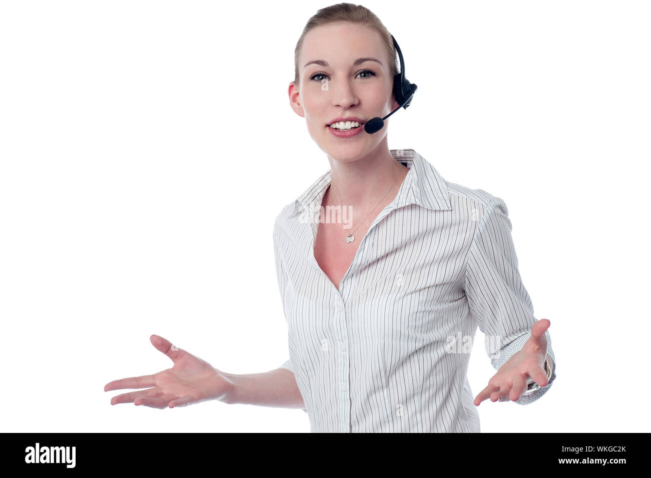 Smiling young call center executive with headset Stock Photo - Alamy