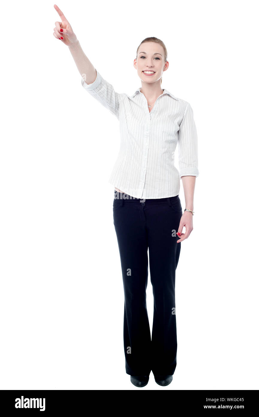 Pretty young corporate woman pointing at something Stock Photo - Alamy