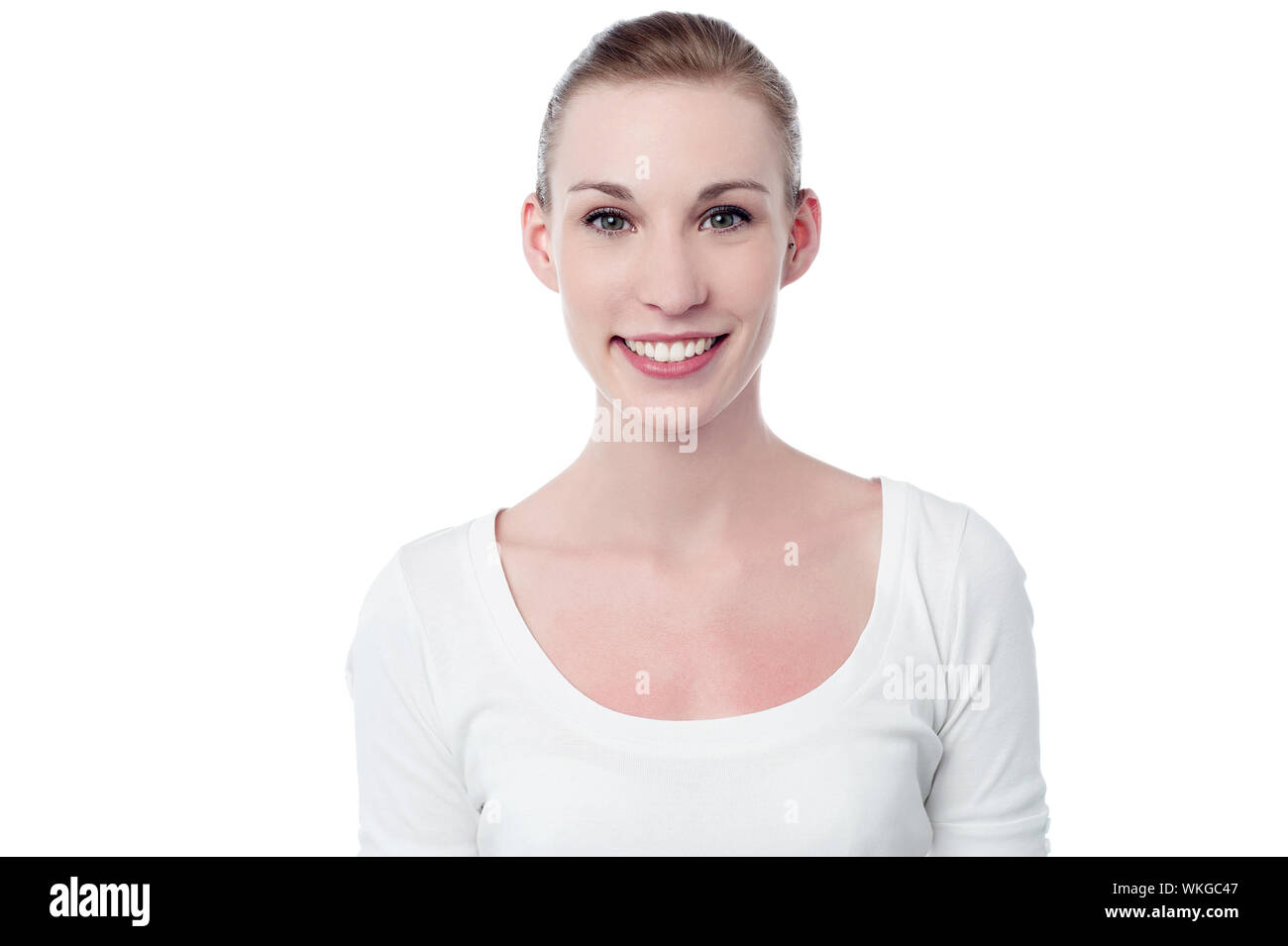 Pretty young girl posing against white background Stock Photo - Alamy