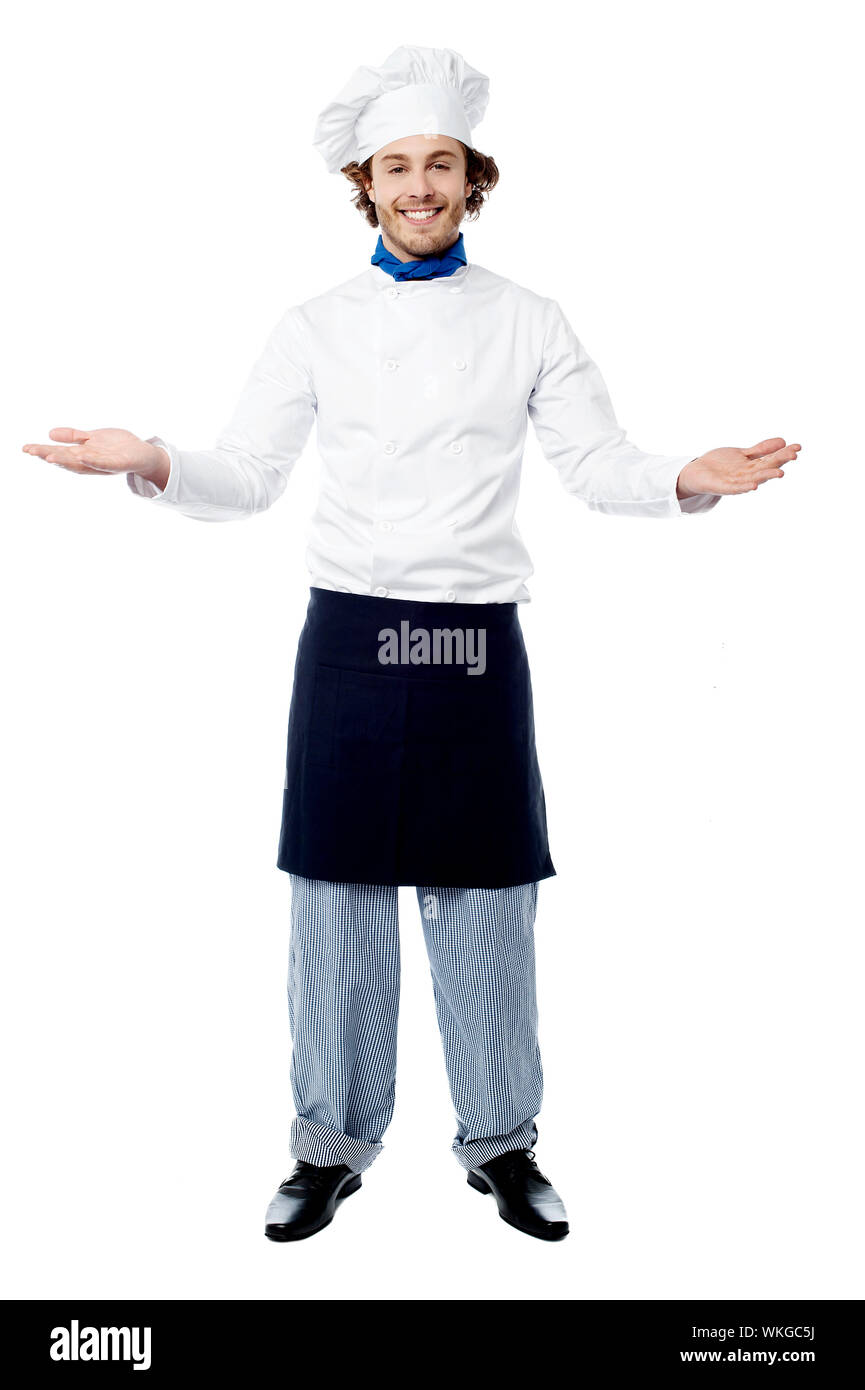 Chef posing with his arms wide open, welcoming guests Stock Photo - Alamy