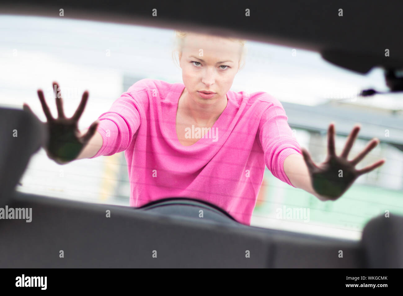 Lady pushing car hi-res stock photography and images - Alamy