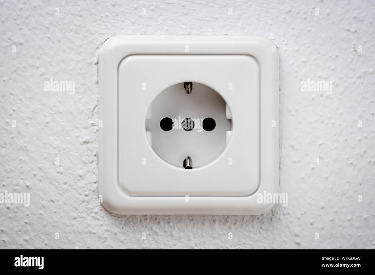 Image of a white socket on a white wall Stock Photo - Alamy