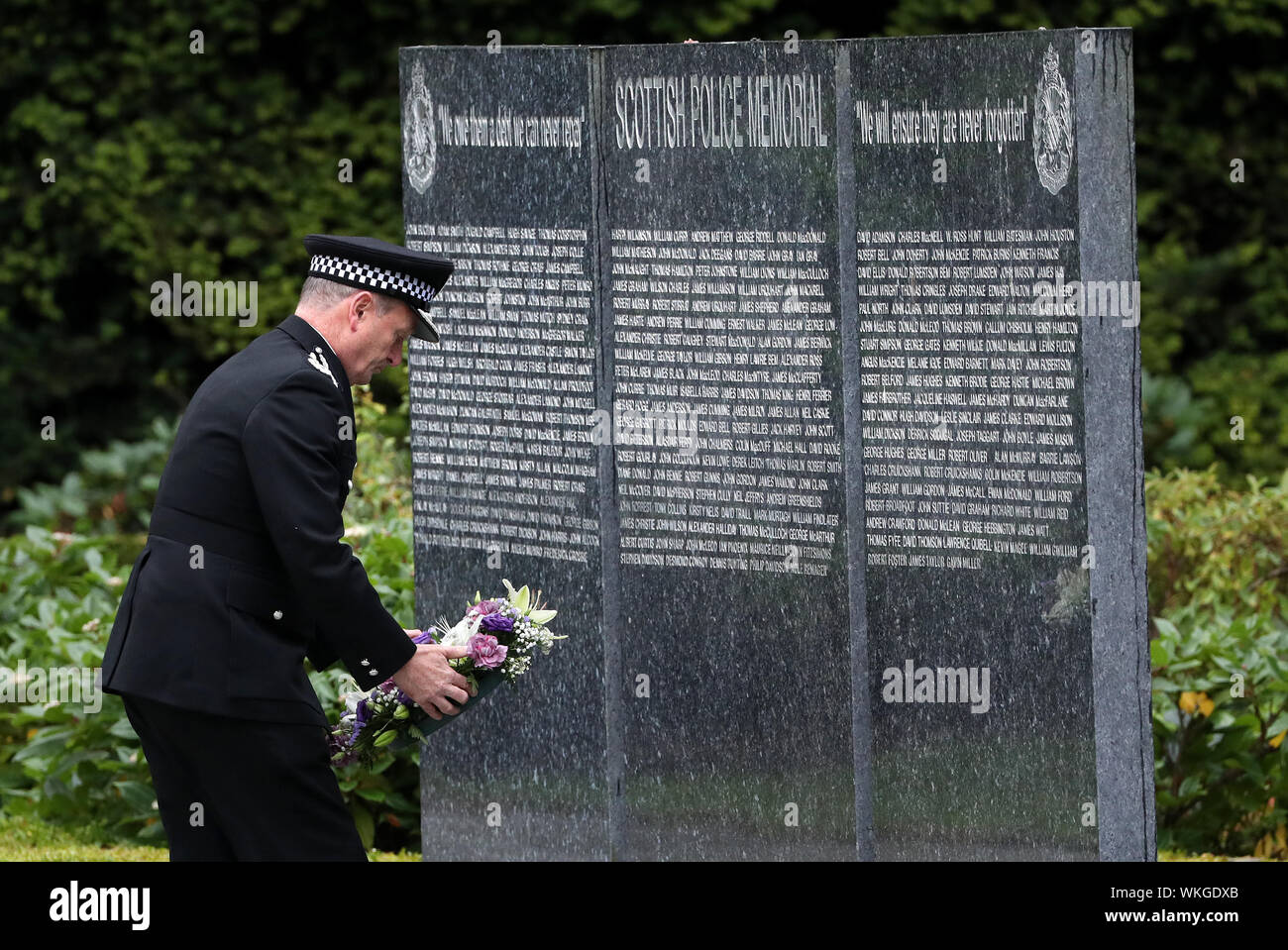 Police Scotland Chief Constable Iain Livingstone lays a wreath as he ...