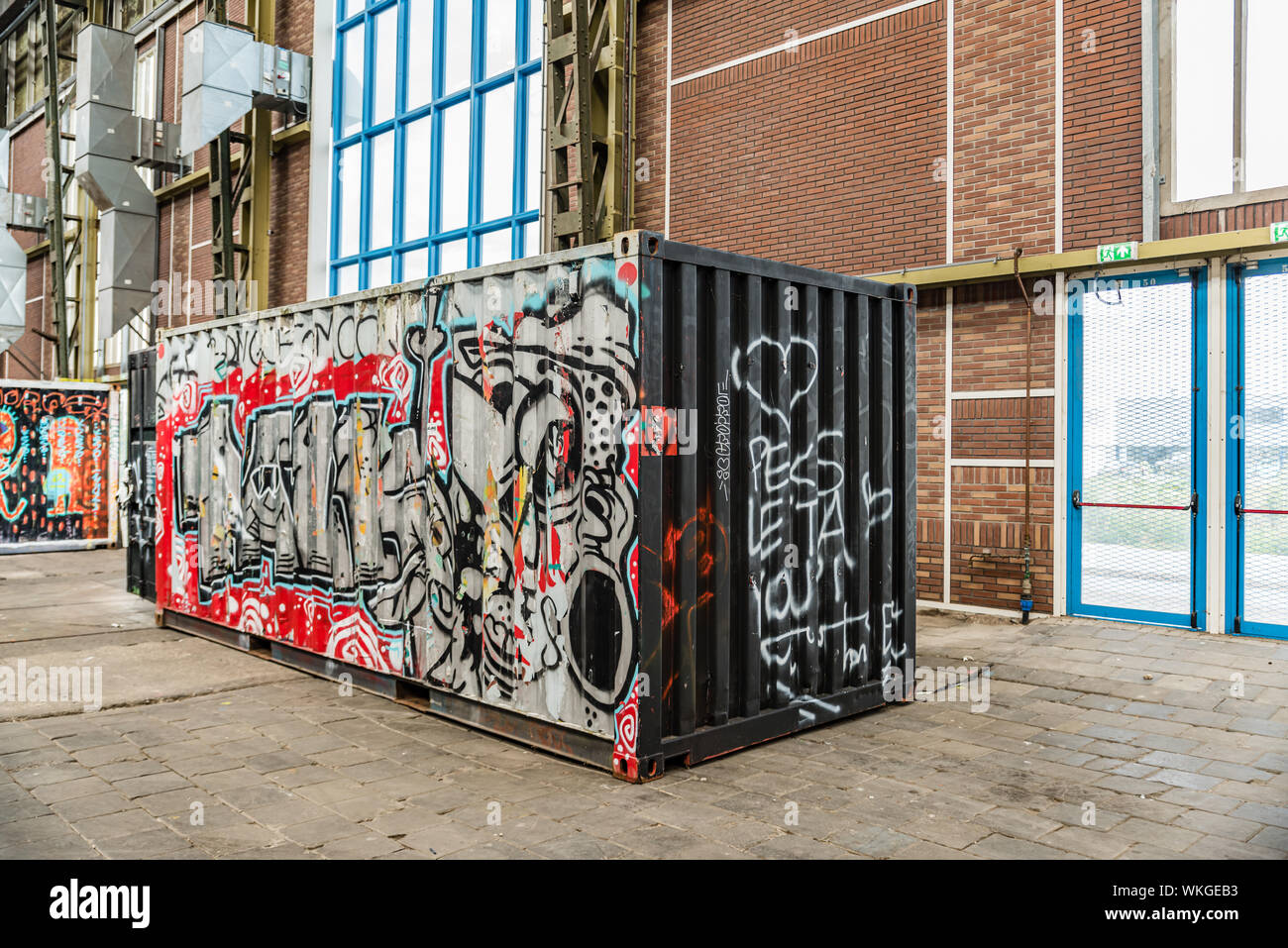 20 feet sea paintbrushed with graffiti container in a big industrial ...