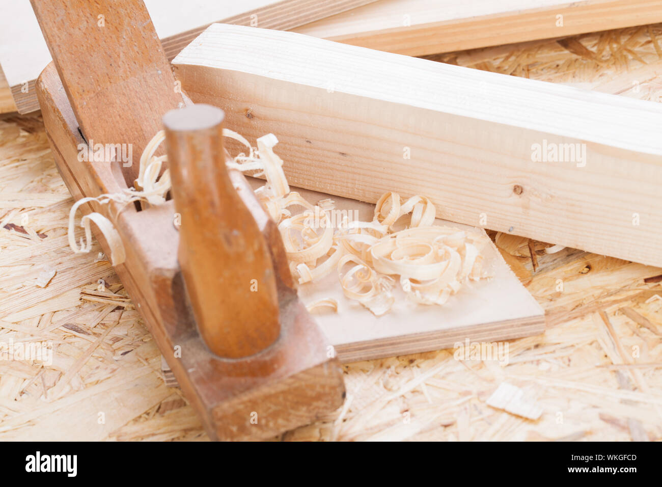 Handheld wood plane with wood shavings Stock Photo - Alamy
