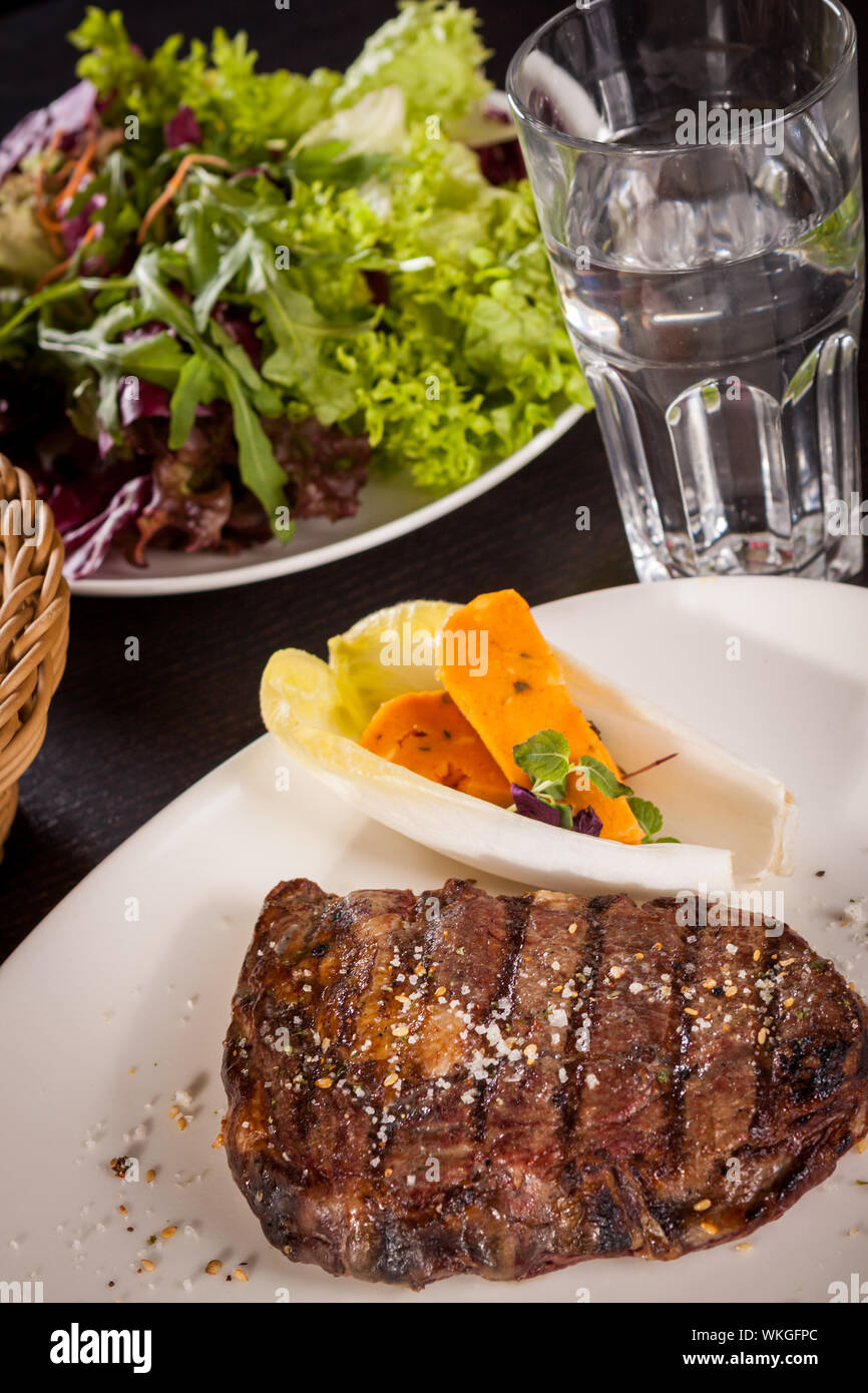 Delicious trimmed lean portion of thick grilled beef steak with ...