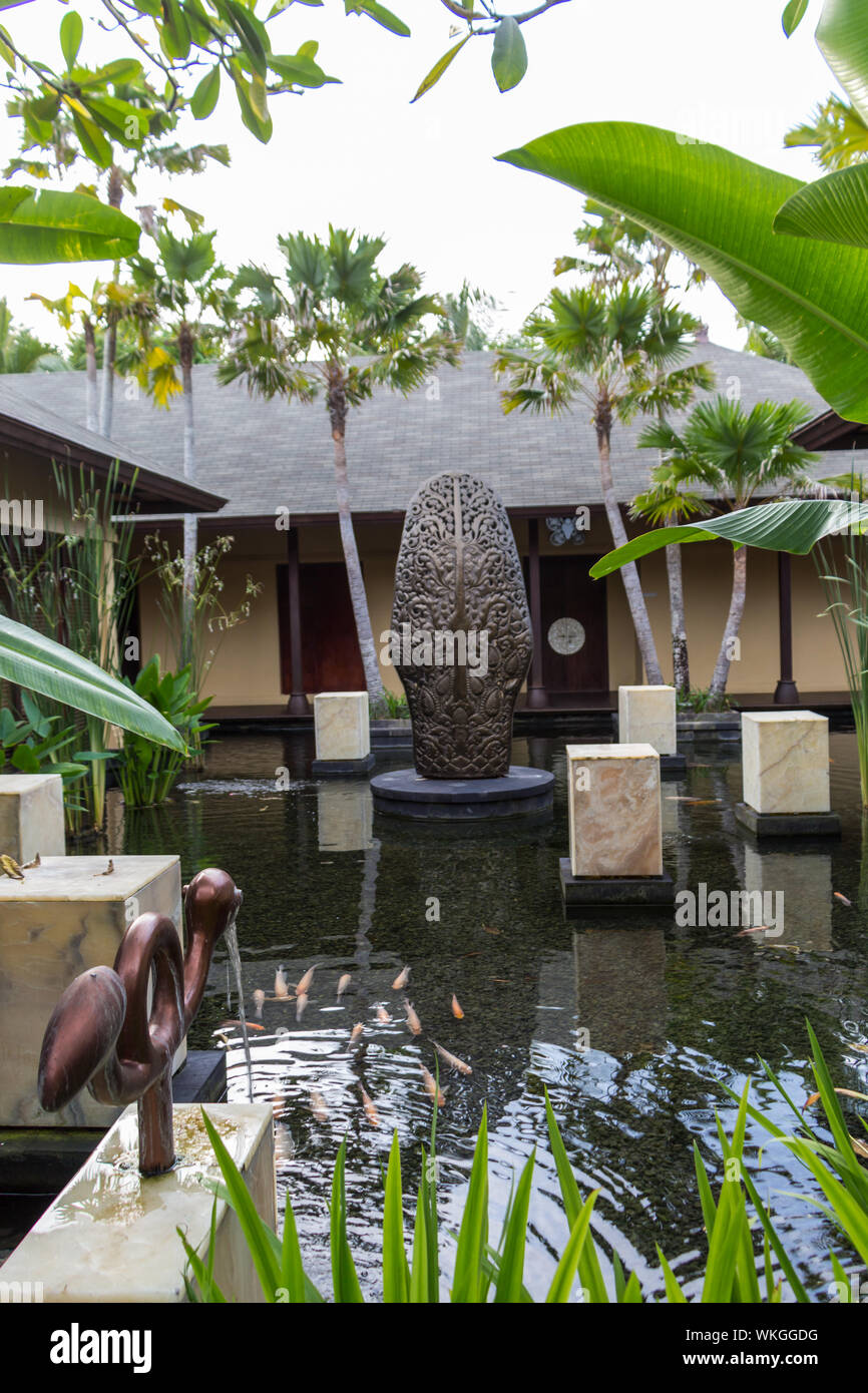 Ornate column in formal Balinese garden Stock Photo - Alamy