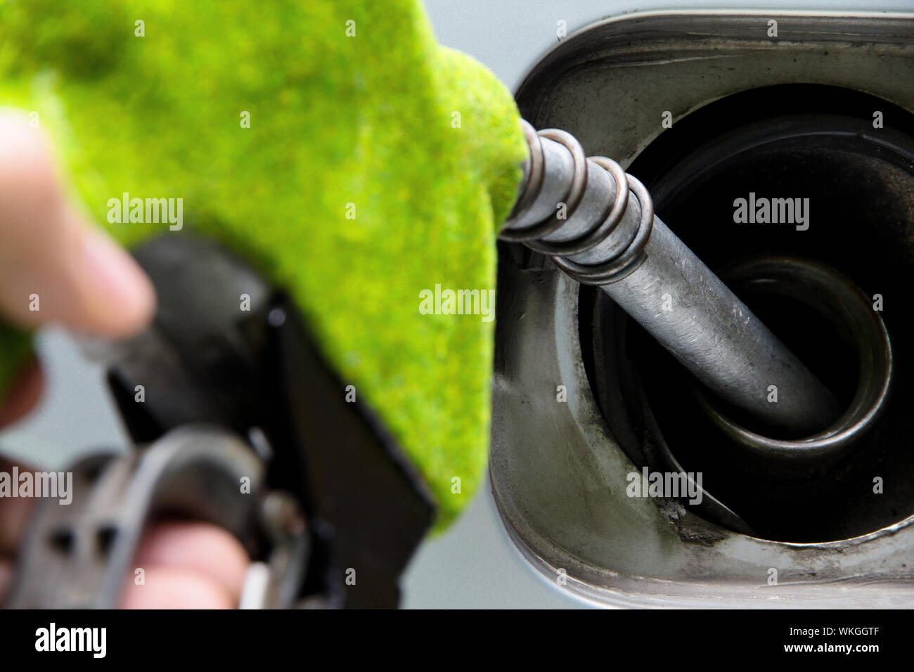 green fuel nozzle,Fill up the gas tank concept Stock Photo - Alamy