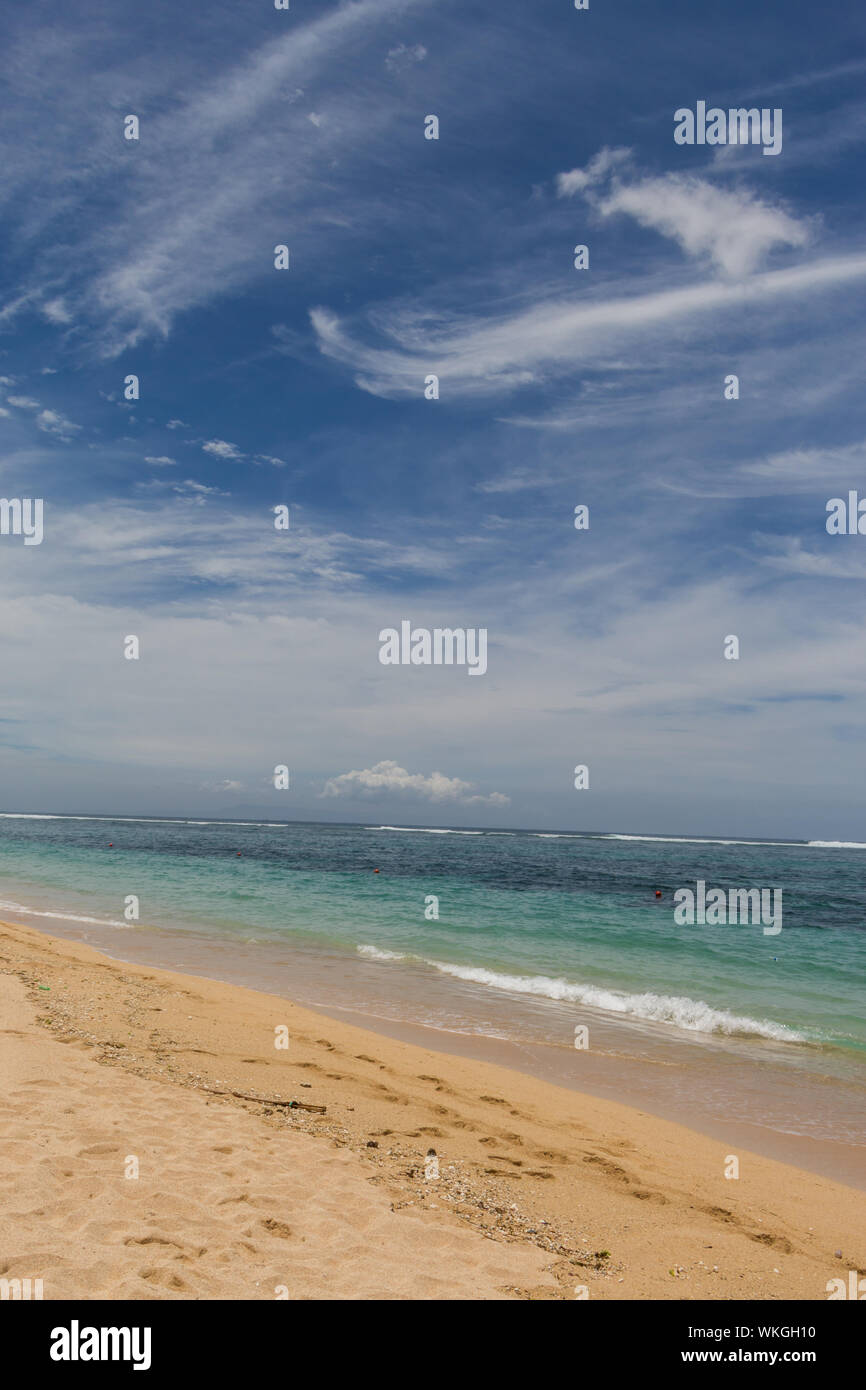 Beautiful tropical beach with lush vegetation fringing golden sand and ...