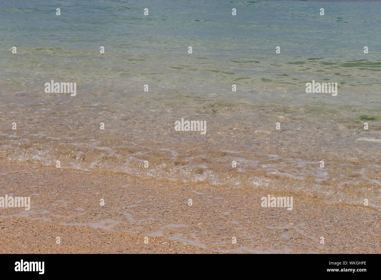 Beautiful tropical beach with lush vegetation fringing golden sand and ...