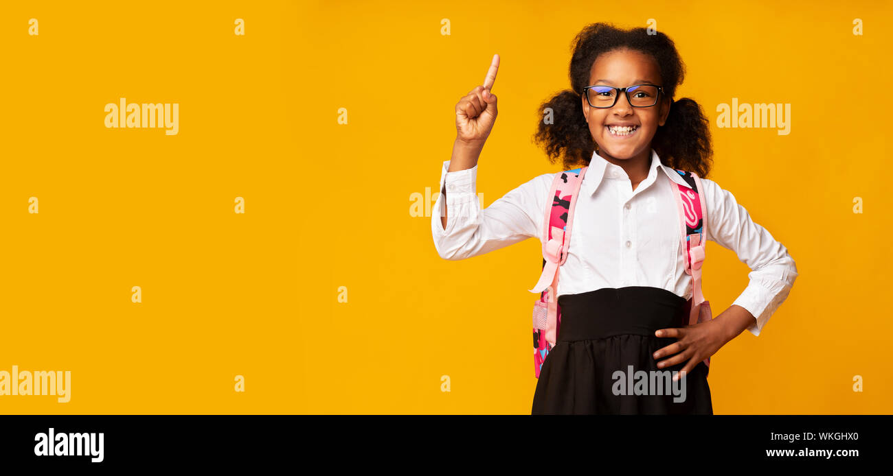 Afro Elementary Student Girl Pointing Finger Up, Yellow Background ...