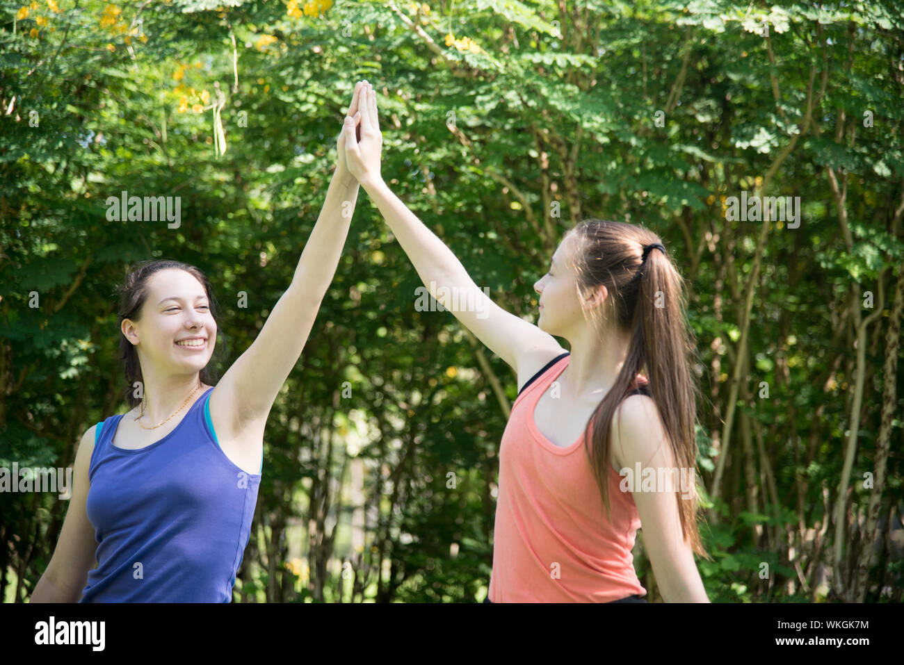 Girls high five outdoors hi-res stock photography and images - Alamy