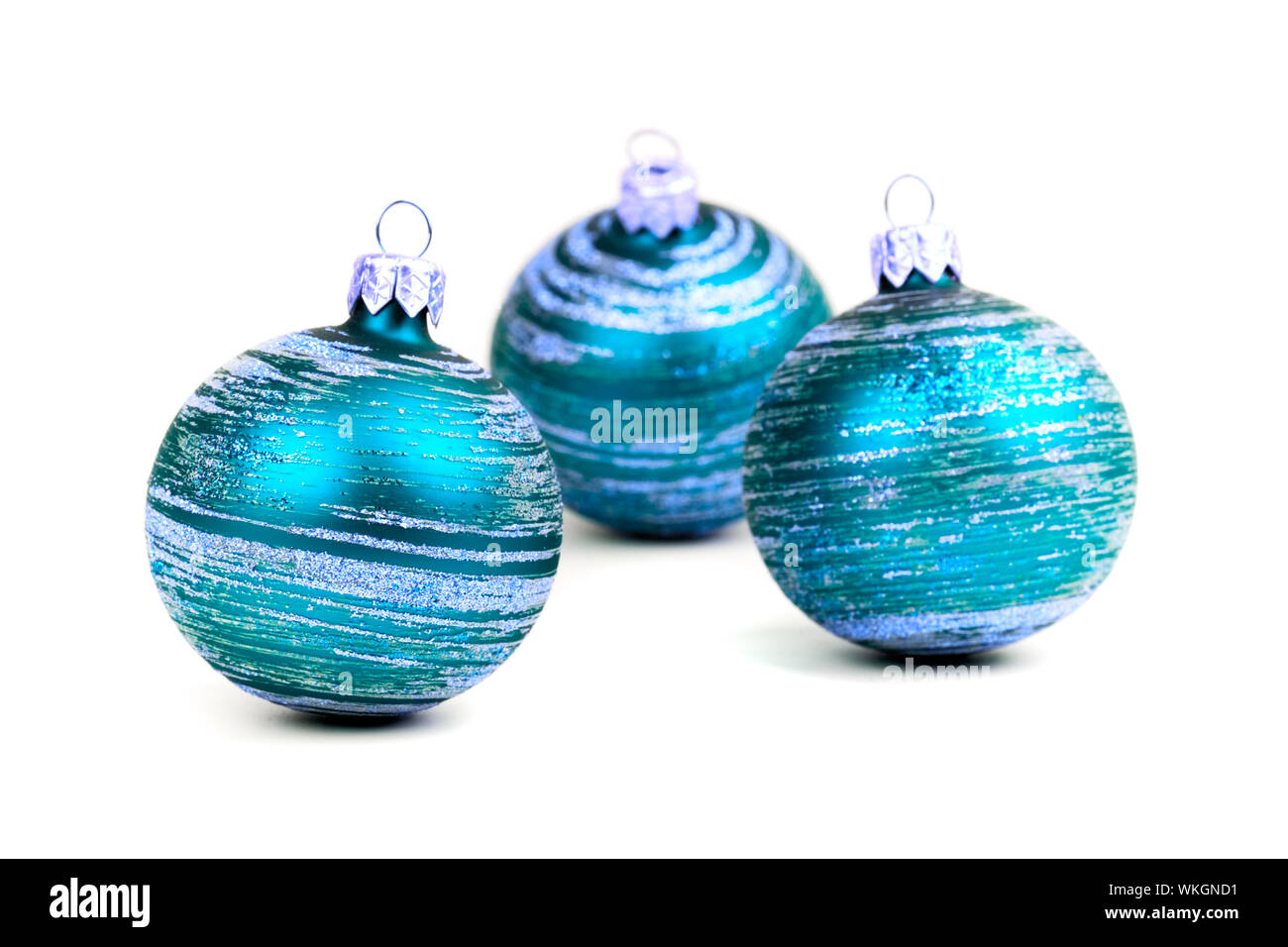three blue christmas balls isolated on white background Stock Photo - Alamy