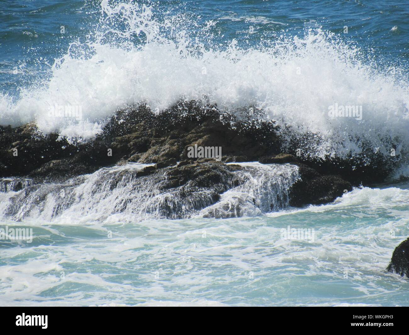 Waves crash against rock surf hi-res stock photography and images - Alamy