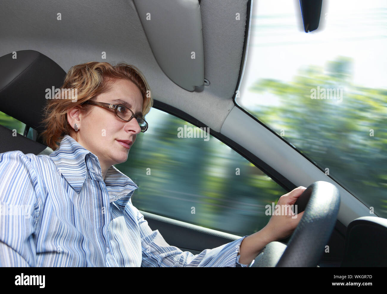 Car mature woman driving hi-res stock photography and images - Alamy