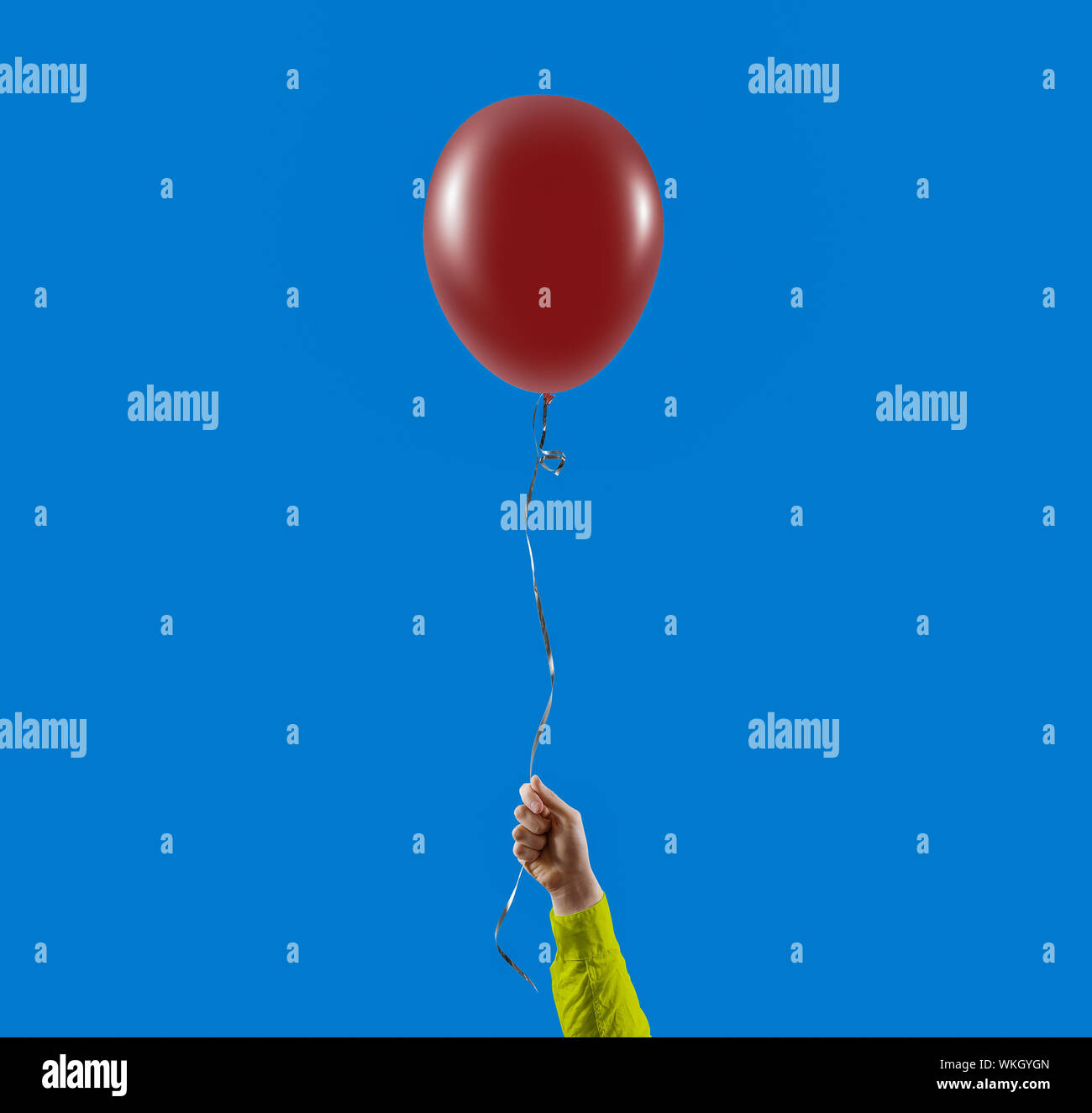 Hand holding balloon hi-res stock photography and images - Alamy