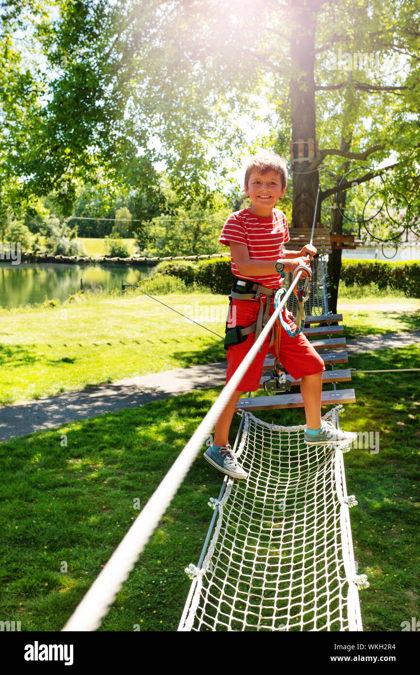 Boy plays in the children rope net playground Stock Photo - Alamy