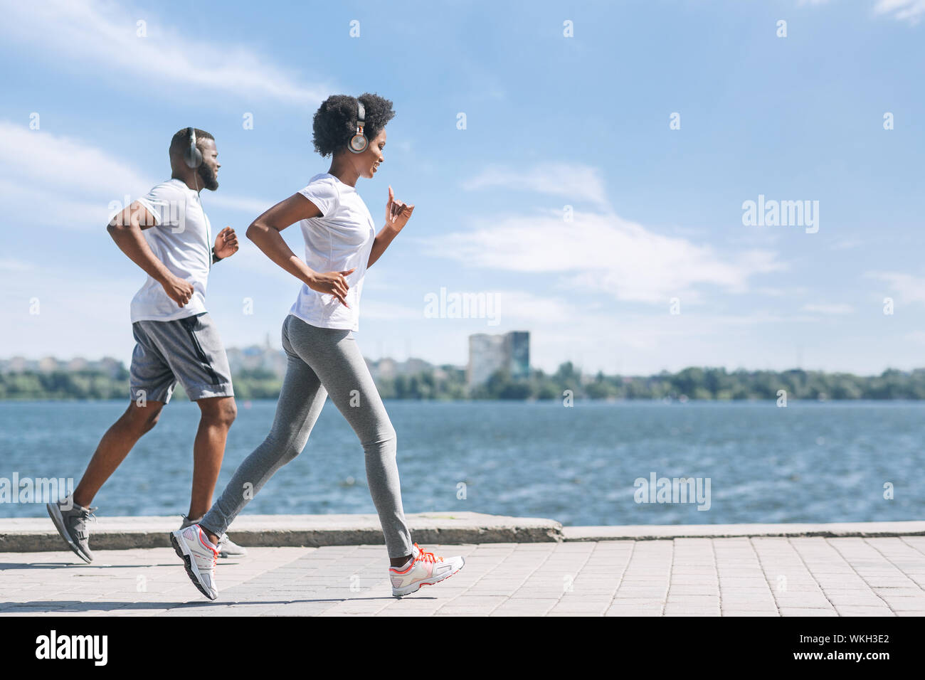 Couple jogging along city hi-res stock photography and images - Alamy