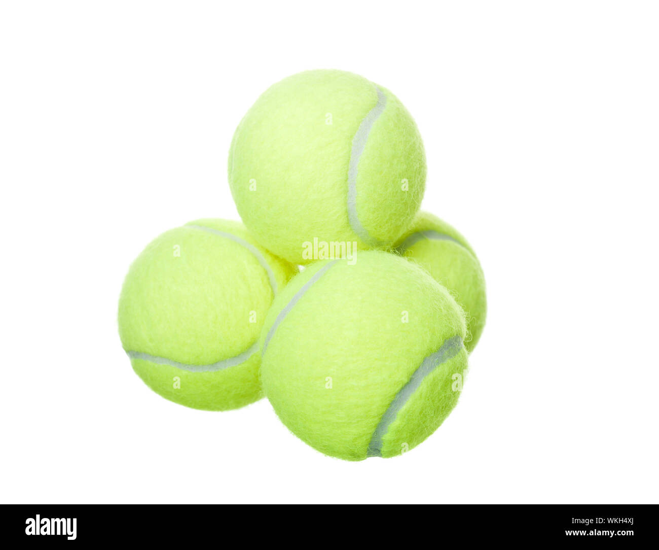 Pyramid of tennis balls isolated on white background Stock Photo - Alamy