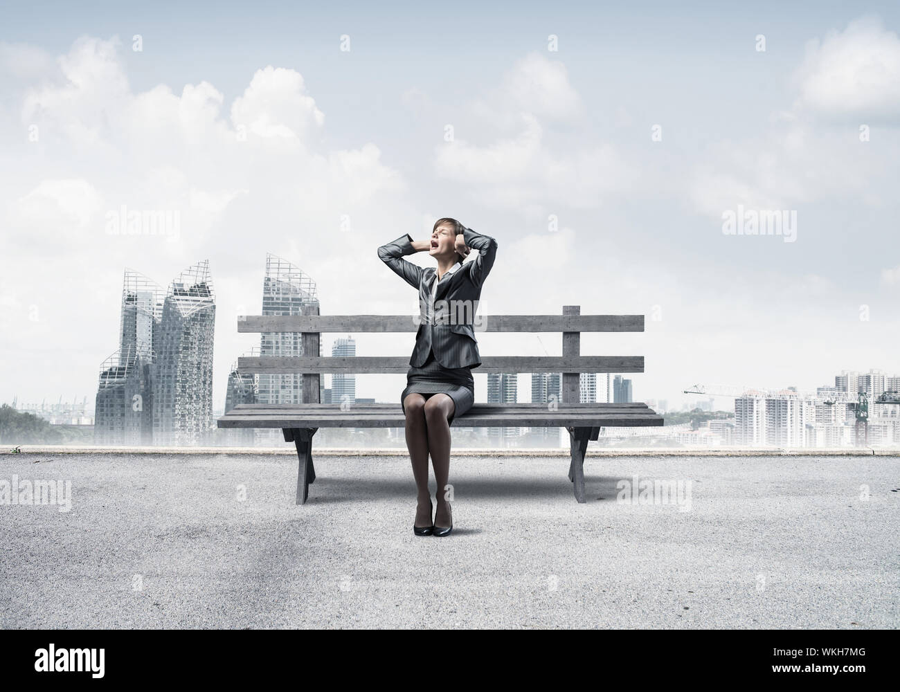 Stressful woman sitting on wooden bench. Emotional screaming girl keeps ...