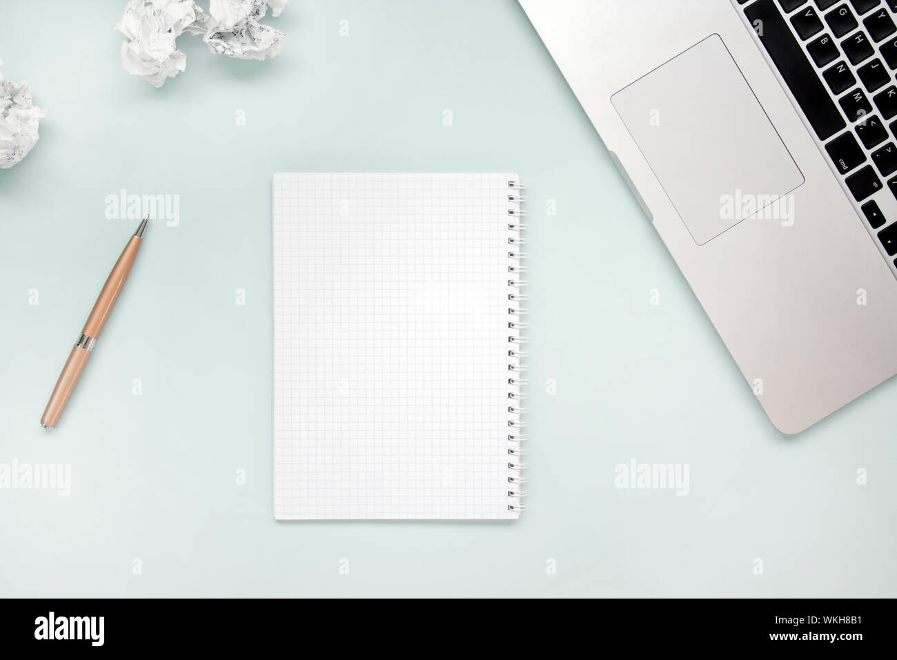 Work and creativity concept. Laptop, notepad, crumpled paper and pen ...