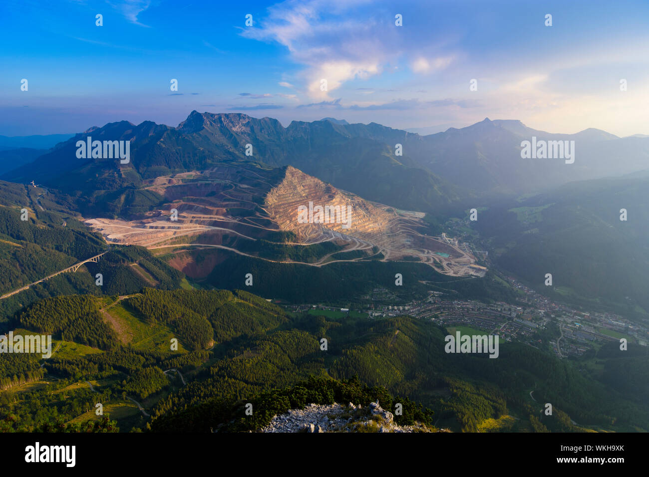 Eisenerz: mountain Erzberg of iron ore mine, town Eisenerz in ...