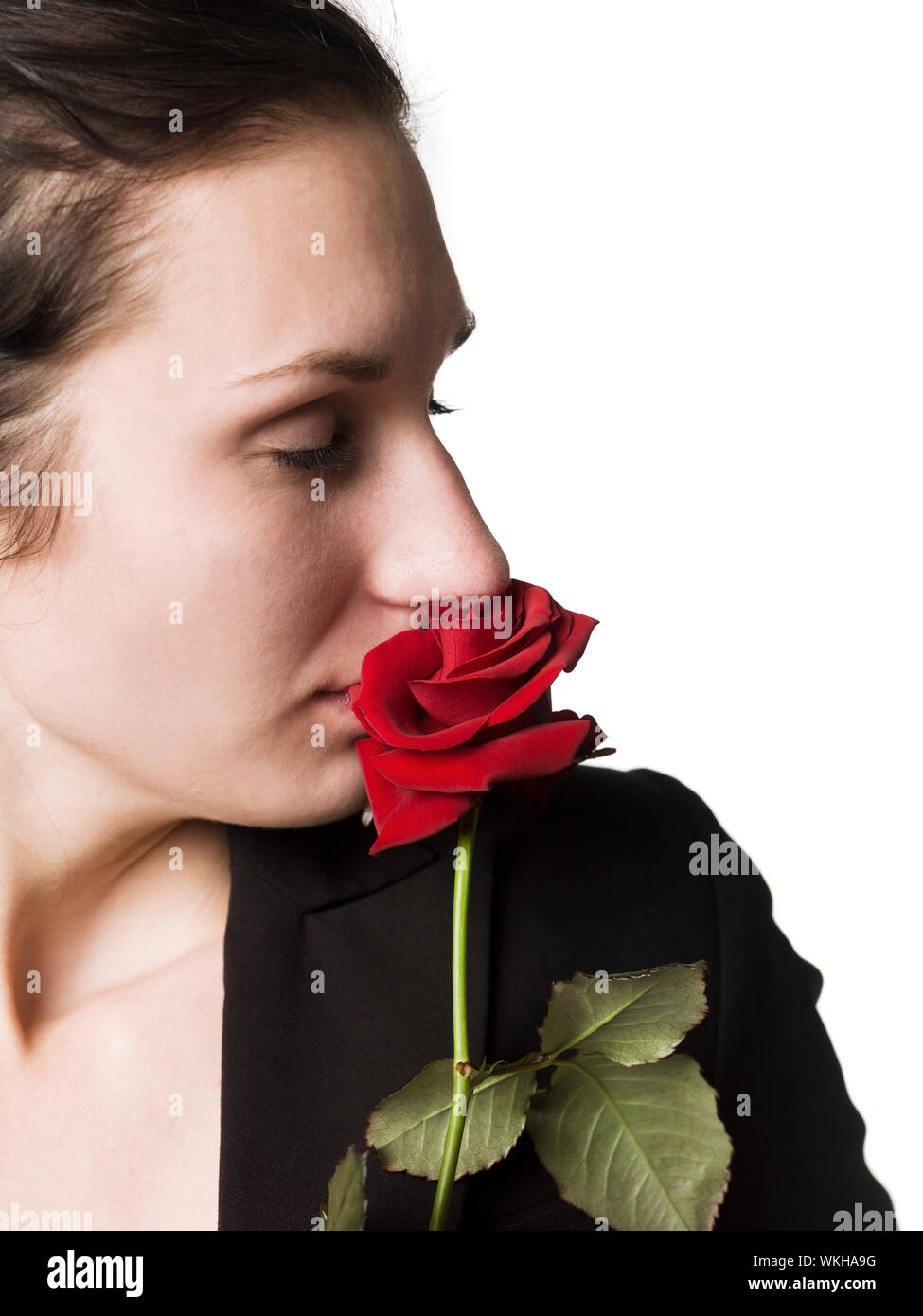 Woman smell a rose Stock Photo - Alamy