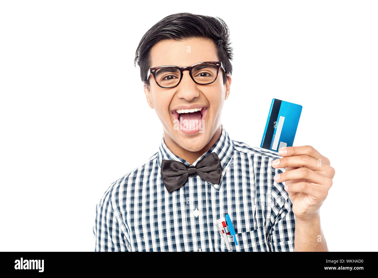 Young cheerful man showing his credit card to camera Stock Photo - Alamy