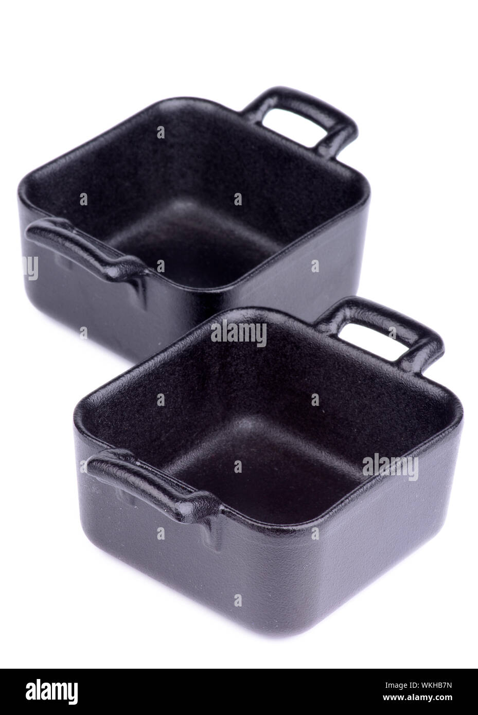 Two Little Portion Cast-iron Square Shape Stew Pots isolated on white ...
