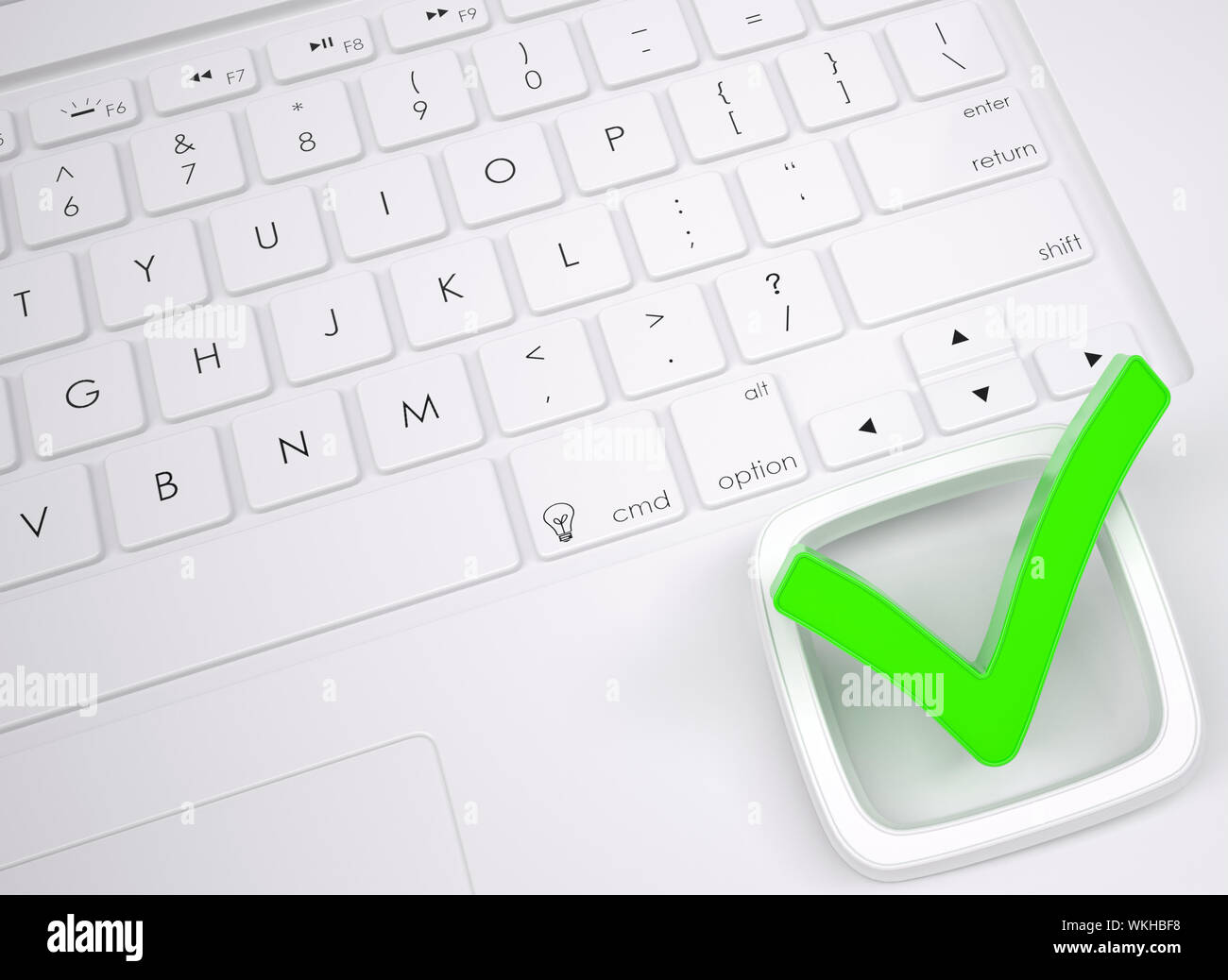 Green check mark on the keyboard. View from above Stock Photo - Alamy