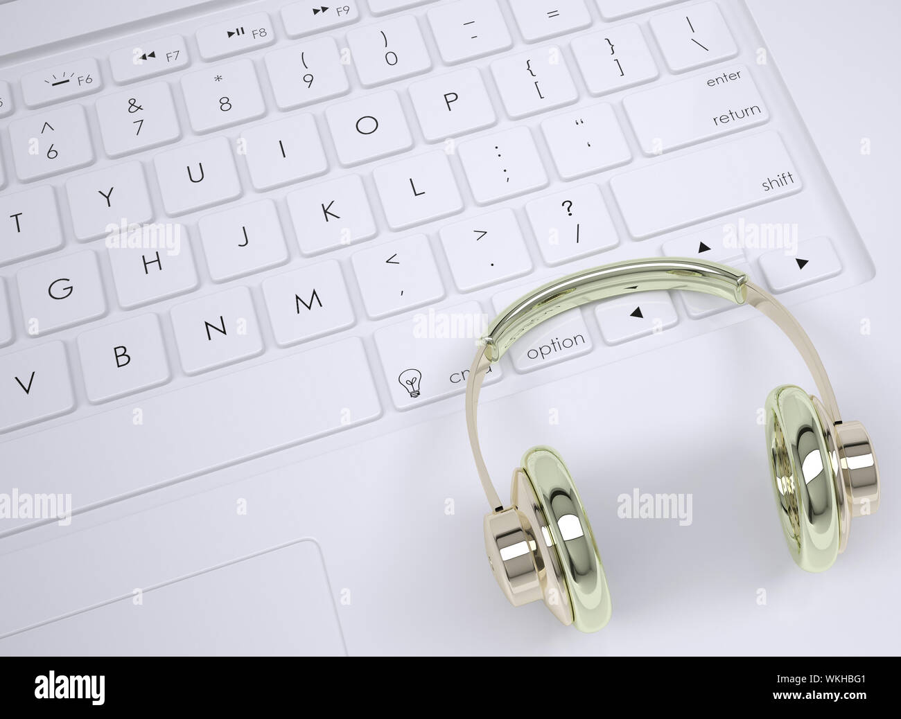 Metal headphones on the keyboard. View from above Stock Photo - Alamy