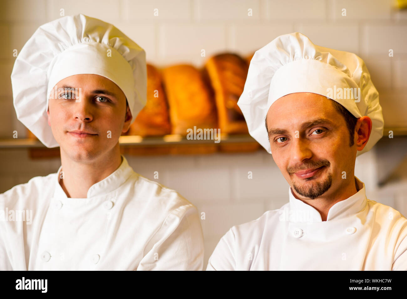 Confident male chefs looking at the camera Stock Photo - Alamy