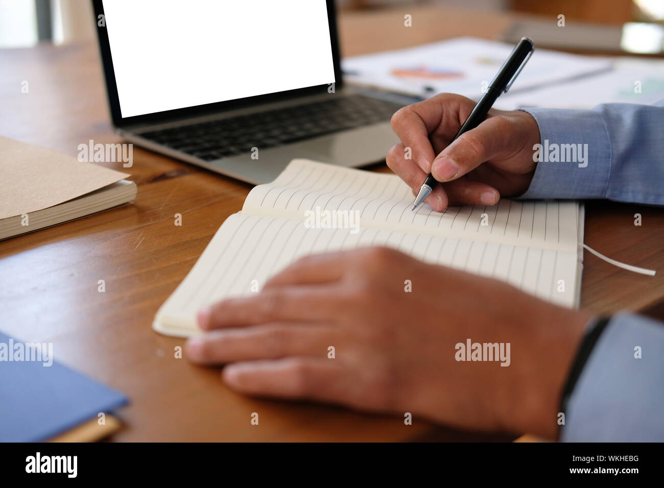 man writing reminder schedule note on notebook. businessman working ...