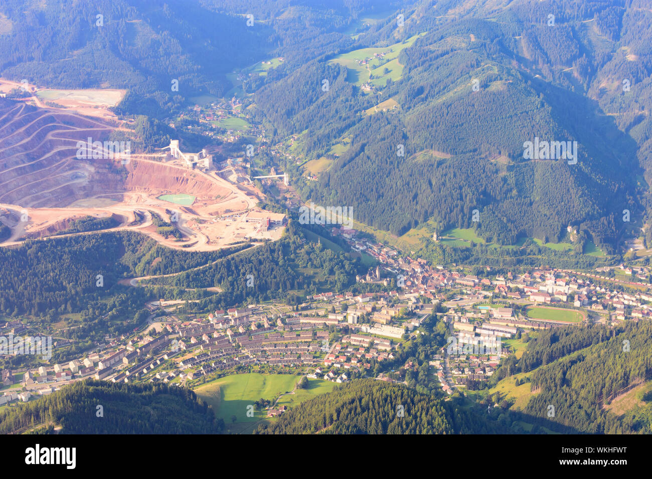 Eisenerz: mountain Erzberg of iron ore mine, town Eisenerz in ...