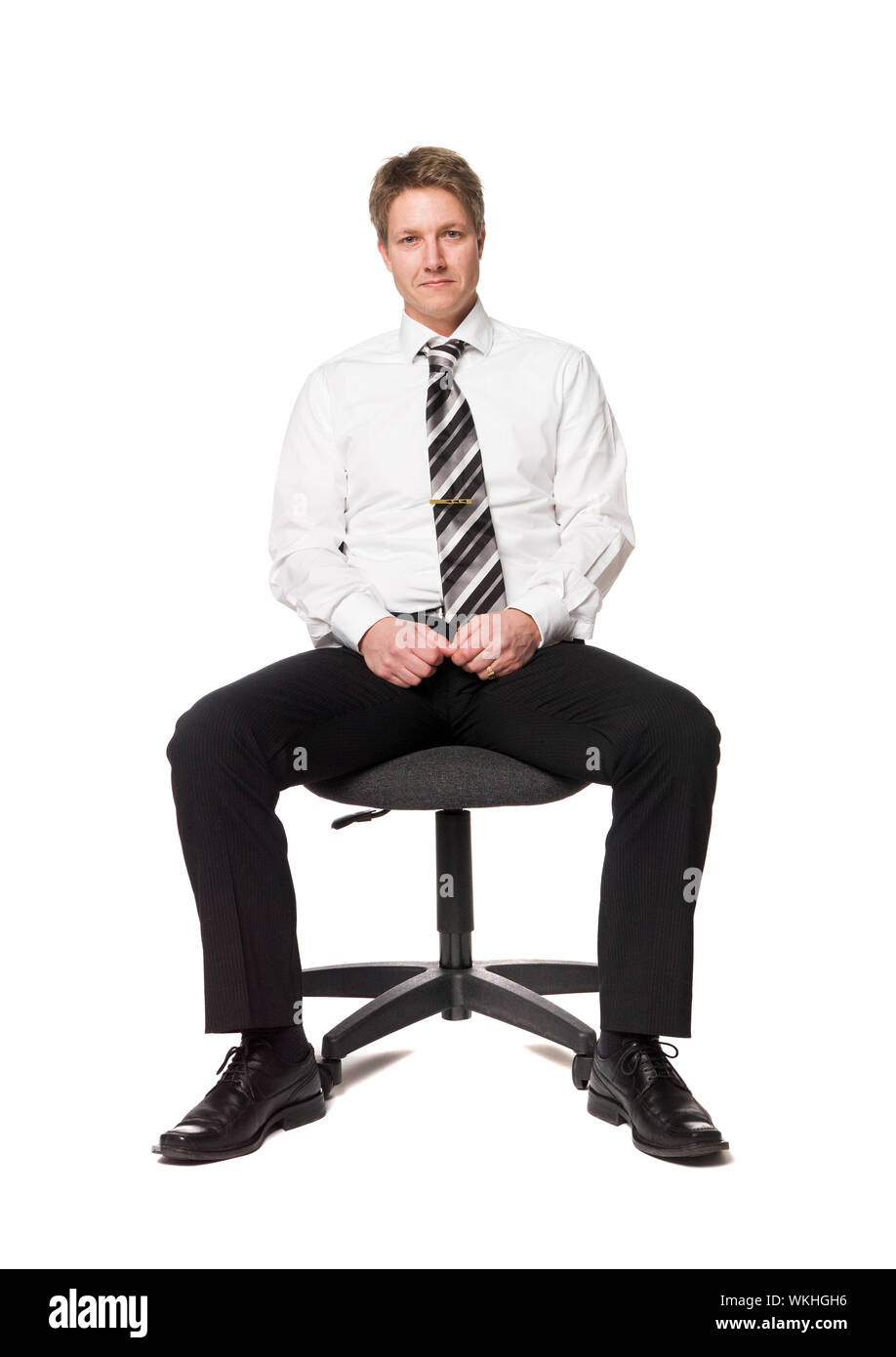 Man siting on an office chair Stock Photo - Alamy