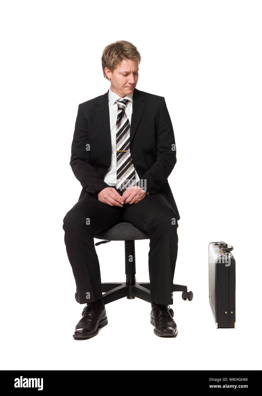 Buisnessman siting on a office chair Stock Photo - Alamy