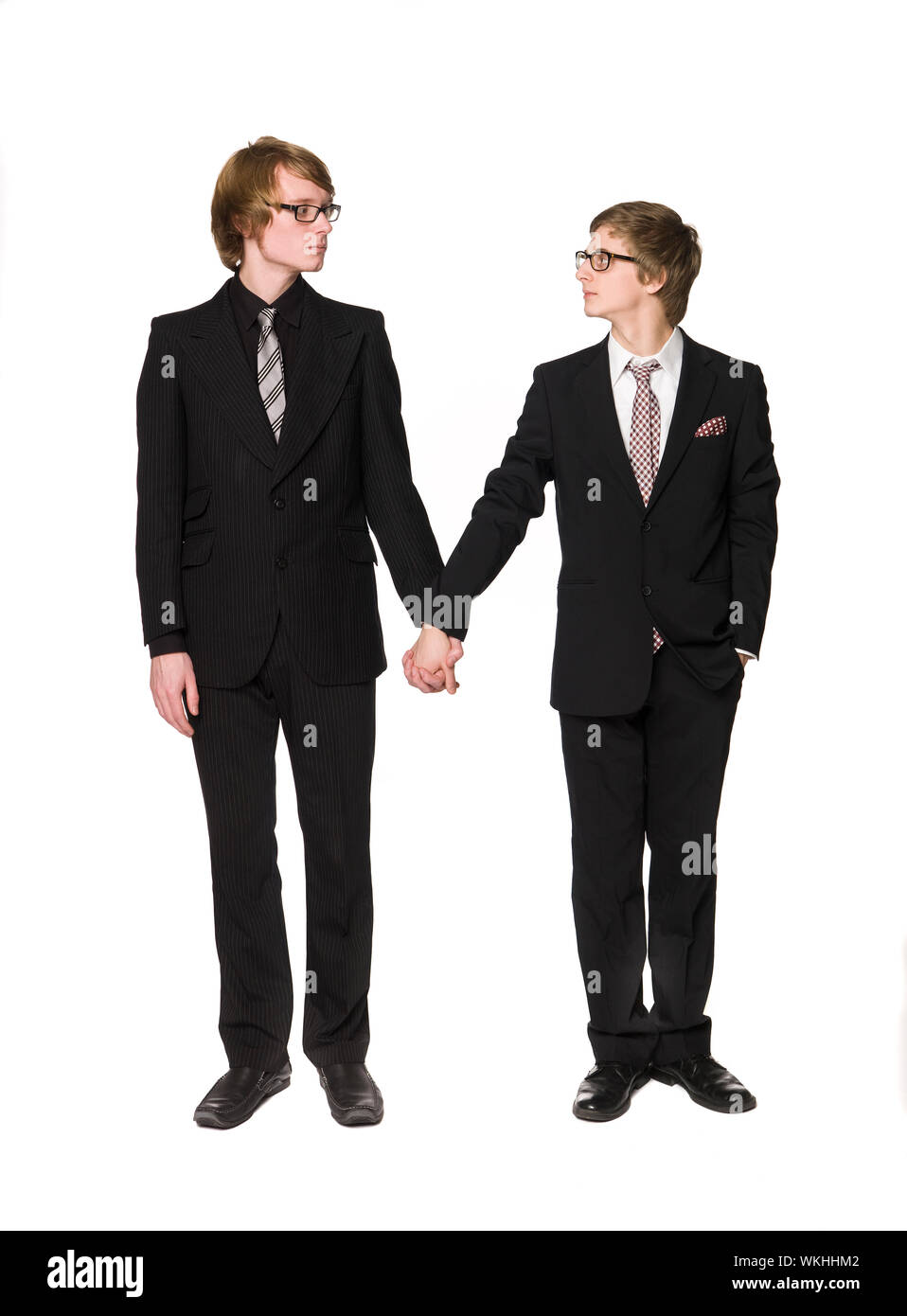 Two men holding hands Stock Photo - Alamy