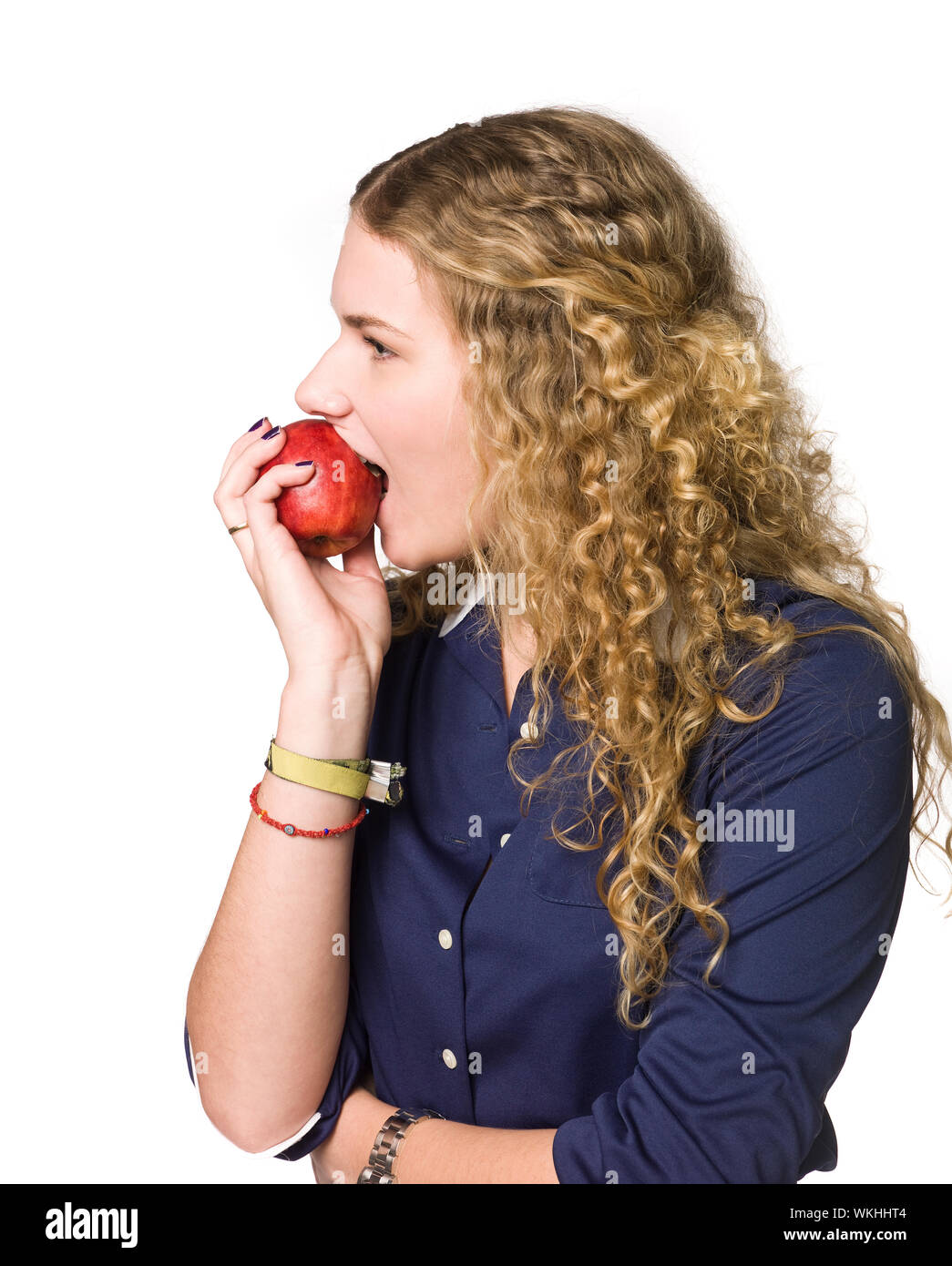 Girl eating an apple Stock Photo - Alamy
