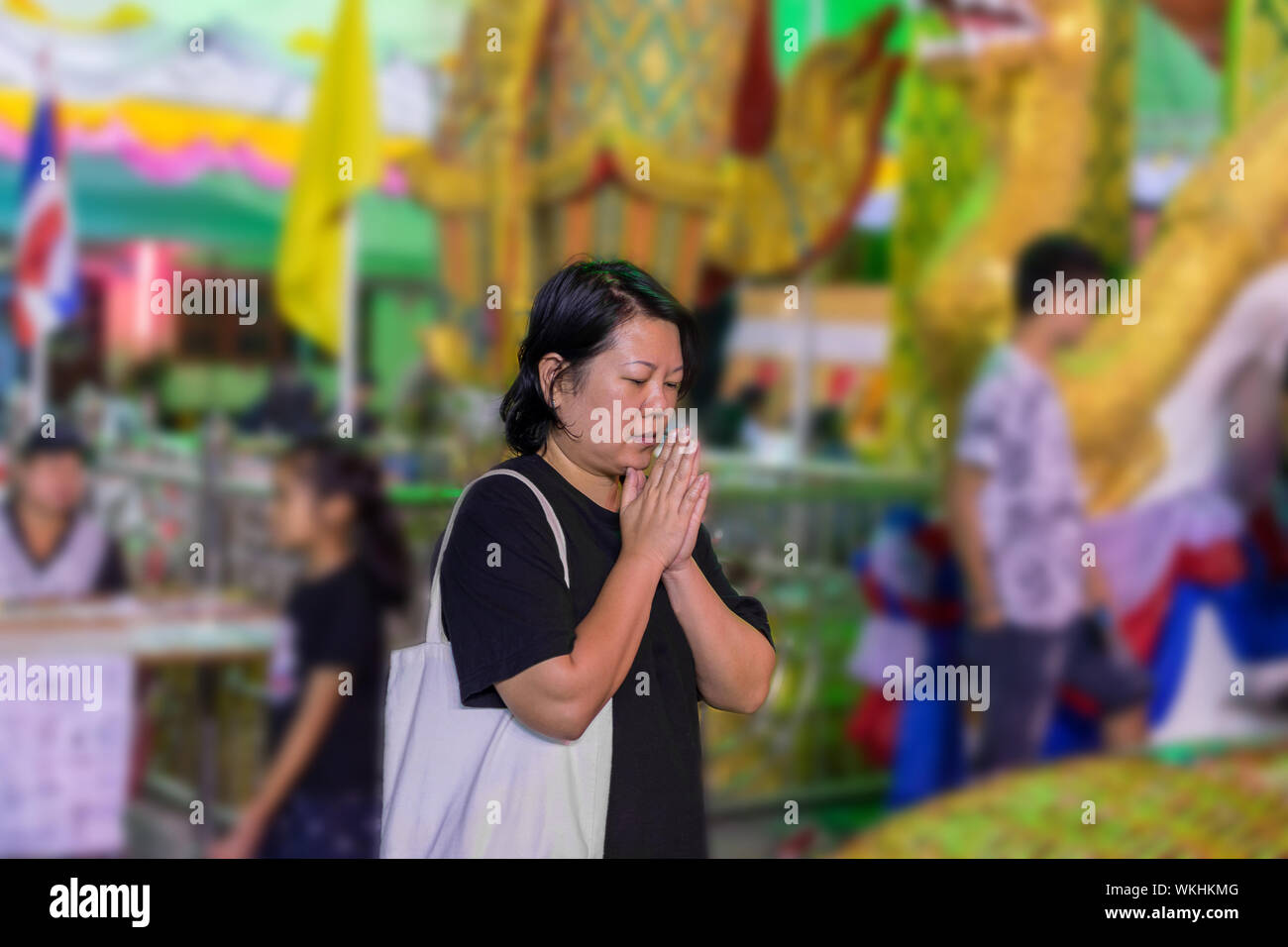 Woman praying temple hi-res stock photography and images - Alamy