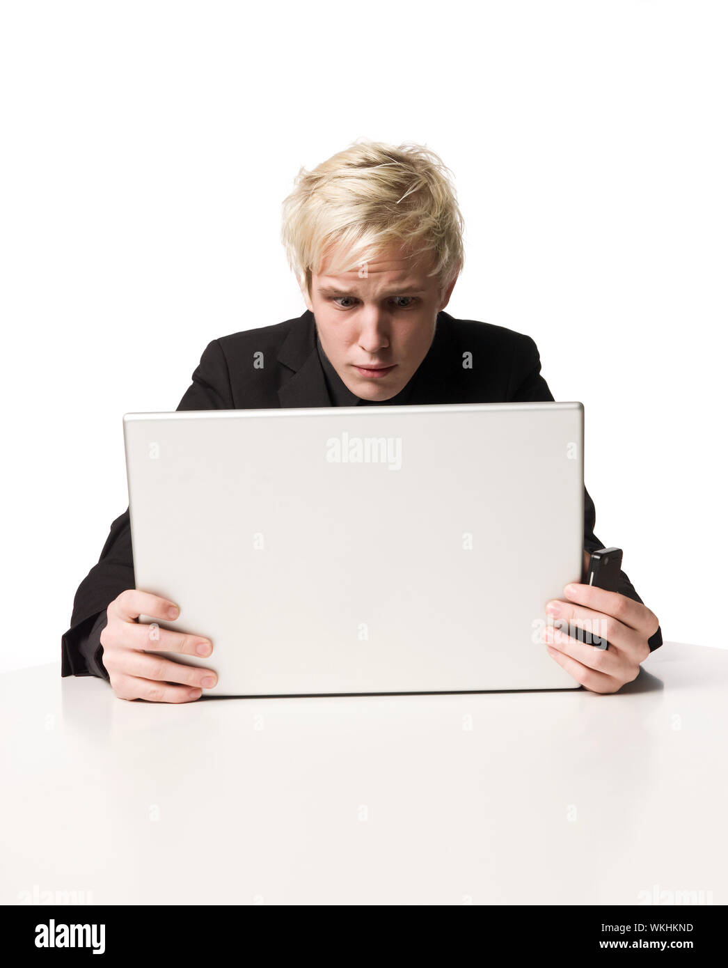 Boy looking on a computer Stock Photo - Alamy