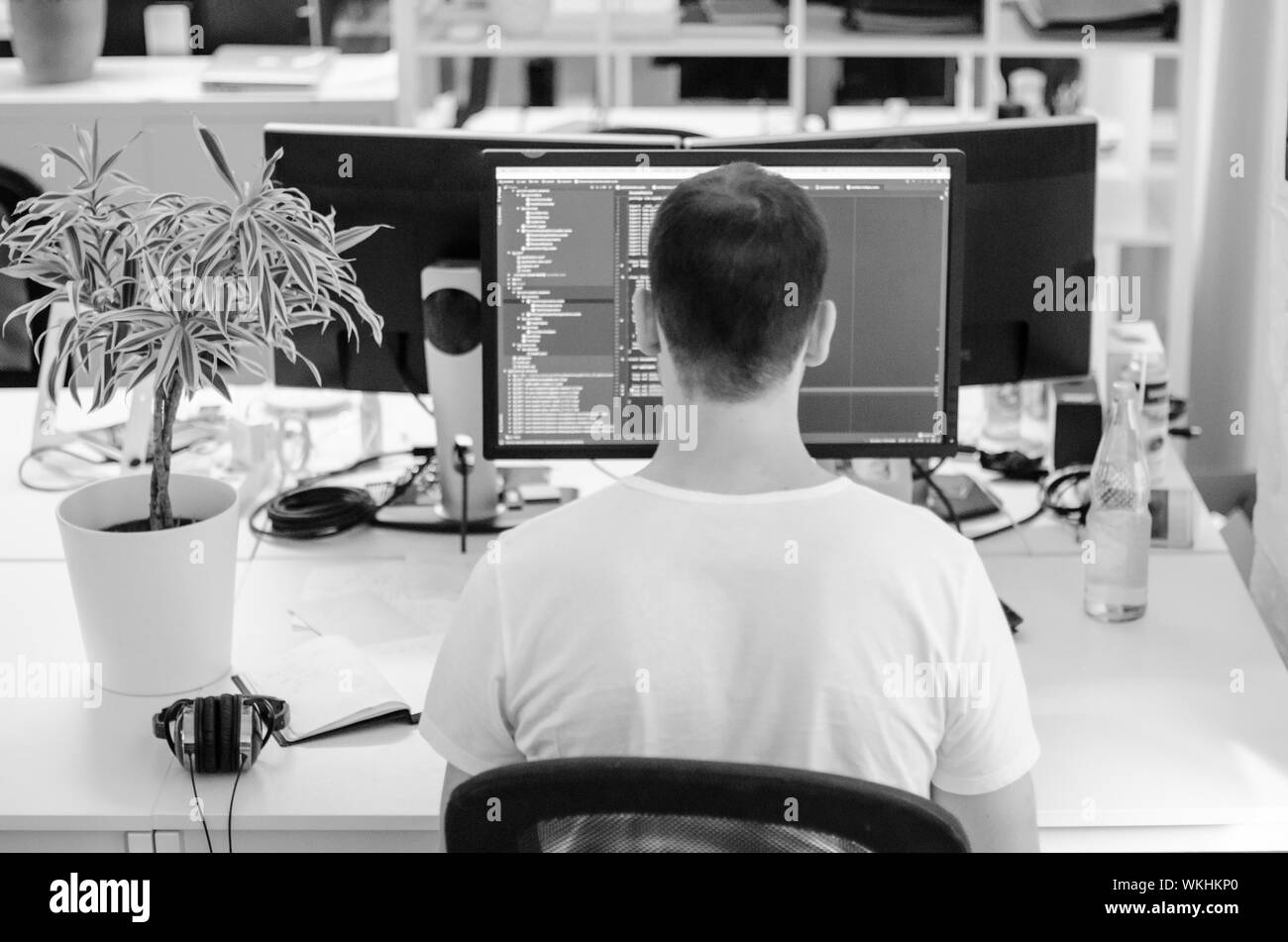 Man sitting office rear view Black and White Stock Photos & Images - Alamy