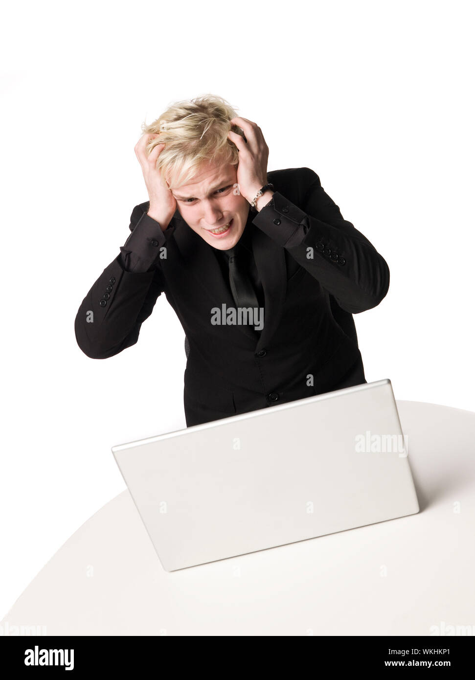 Man looking on a computer Stock Photo - Alamy