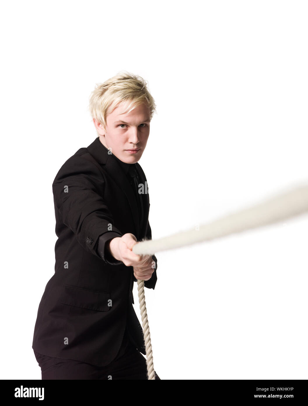 Boy pulling a rope Stock Photo - Alamy