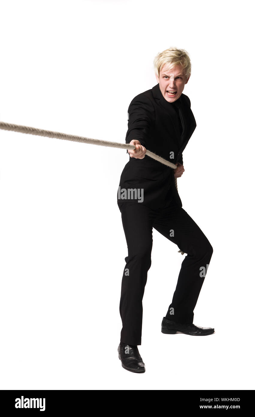 Boy pulling a rope Stock Photo - Alamy