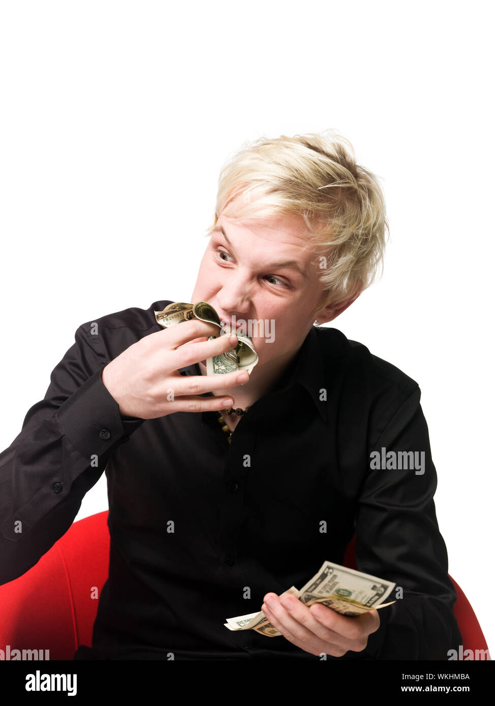 Man eating money Stock Photo - Alamy